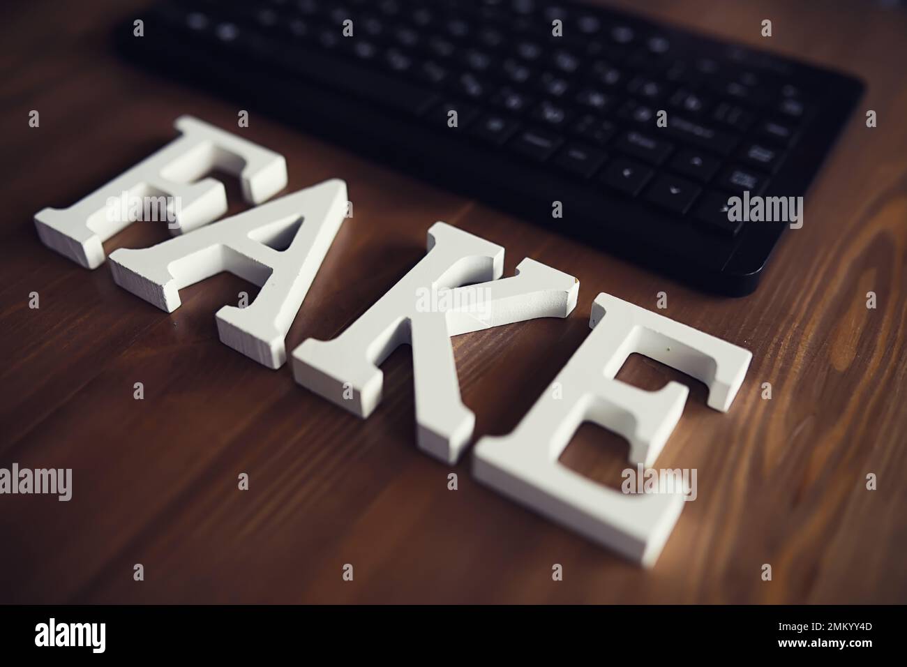 The letters spelled the word fake. The concept of modern information ...