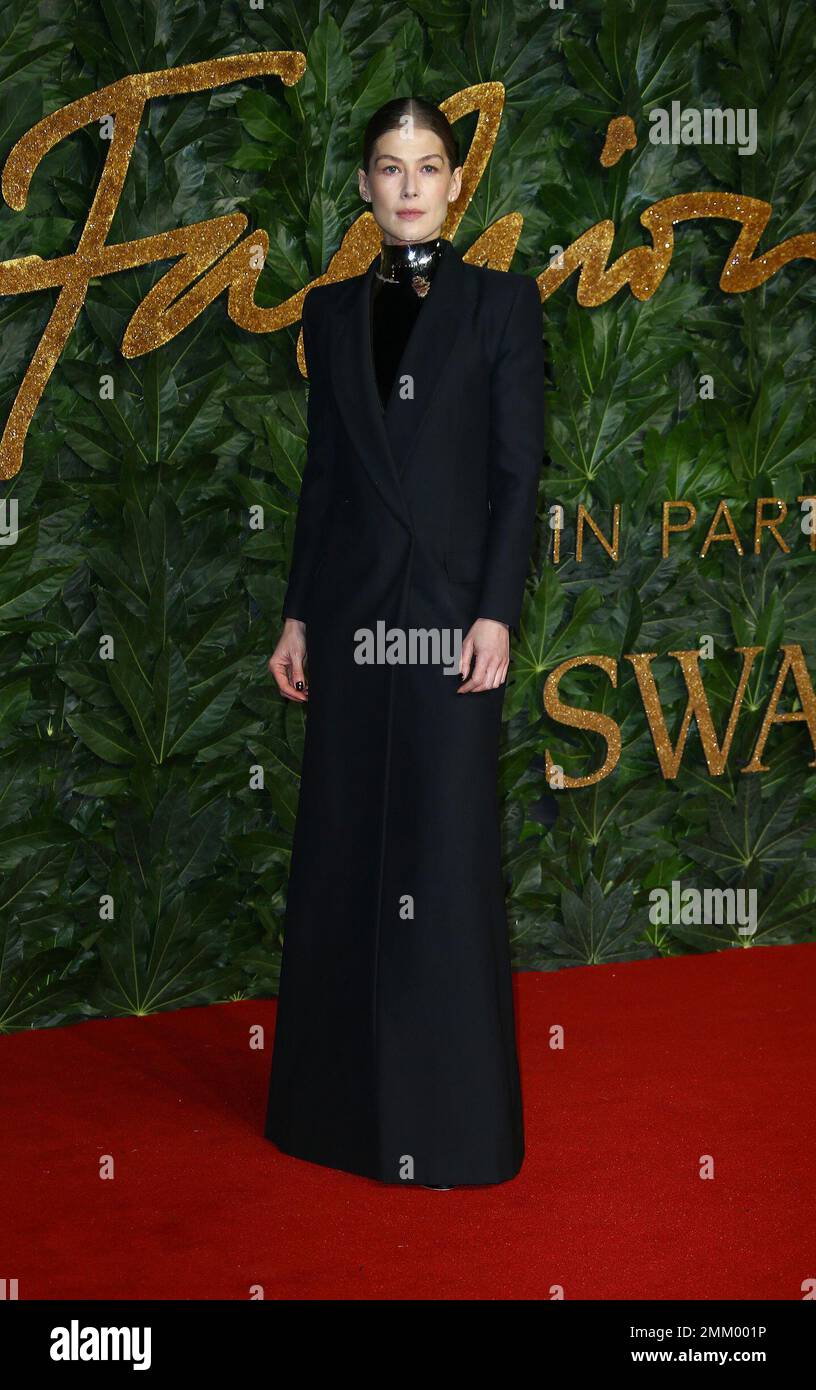 Rosamund Pike poses for photographers upon arrival at the The Fashion ...