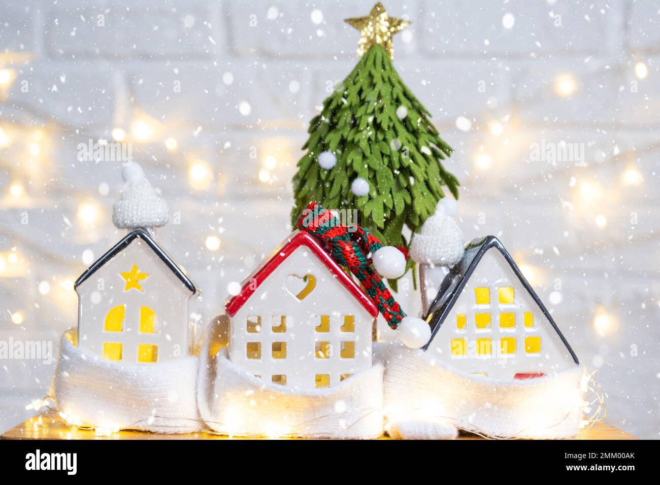 Cozy house is wrapped in a hat and scarf in a snowstorm -window sill ...