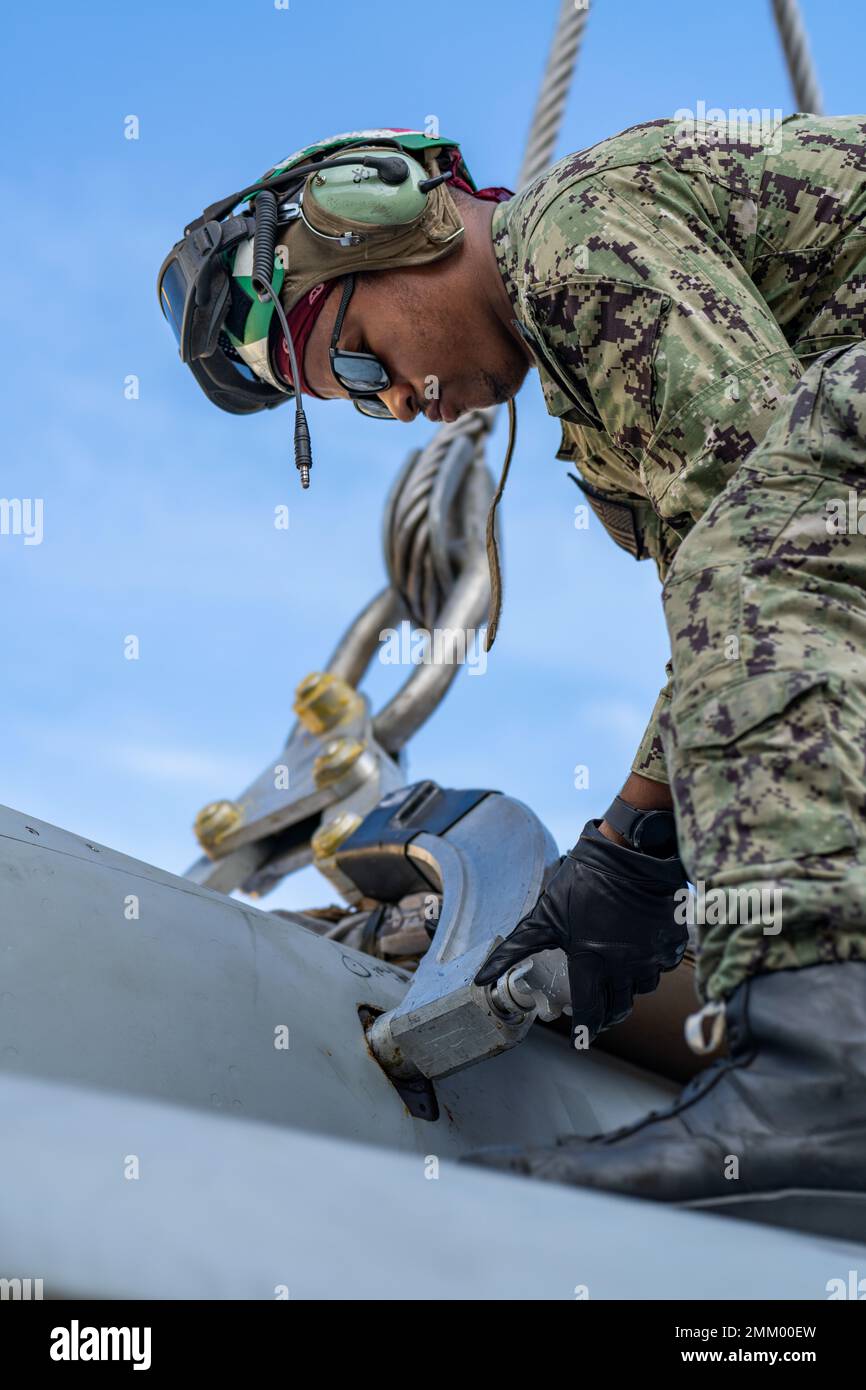 A U.S. Navy Sailor assigned to Marine Corps Air Station Iwakuni harbor ...