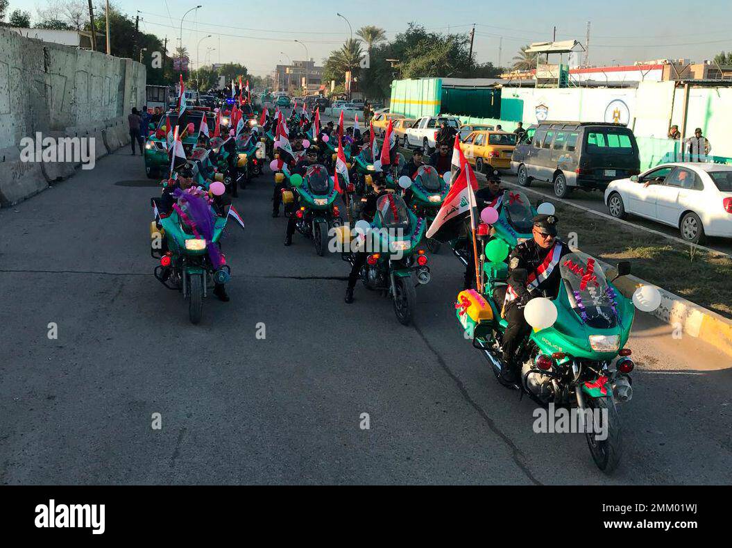 Iraqi security forces parade on motorcycles with national flags marking ...