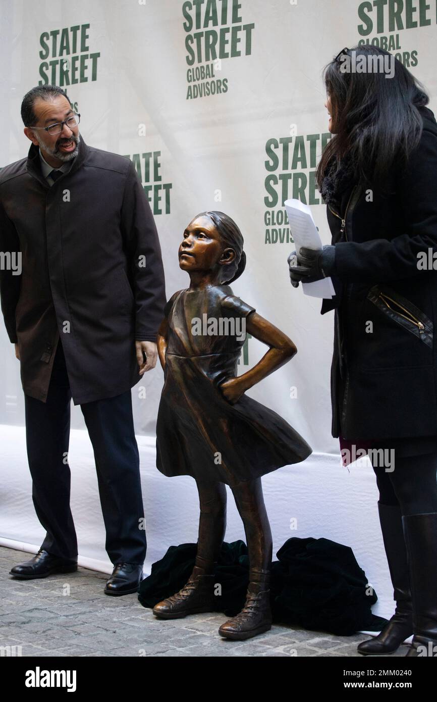 The Fearless Girl statue is unveiled at its new location in front of ...