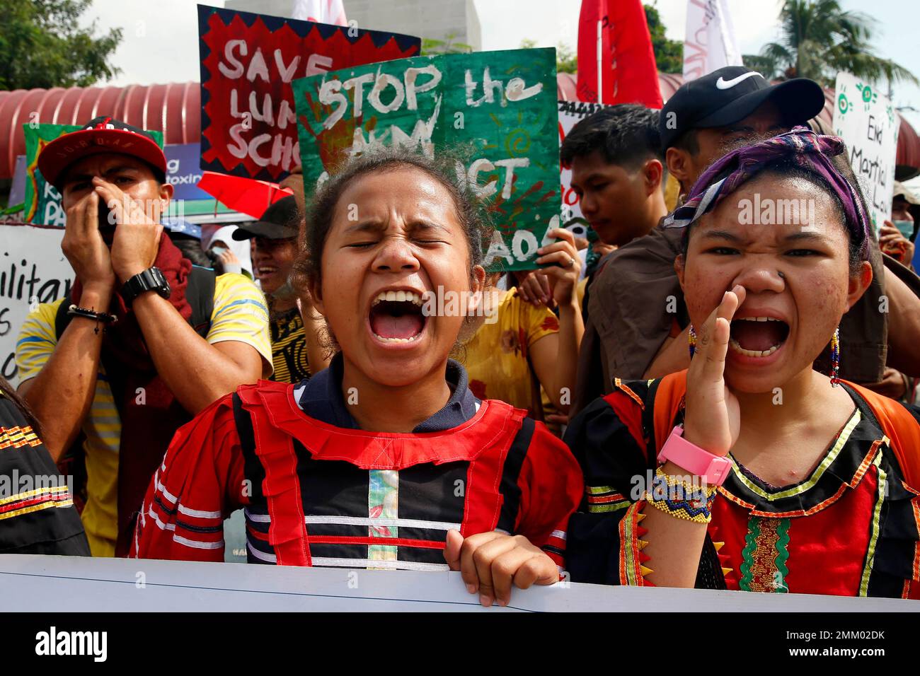 Indigenous people shout slogans during a rally at the Philippine Senate ...