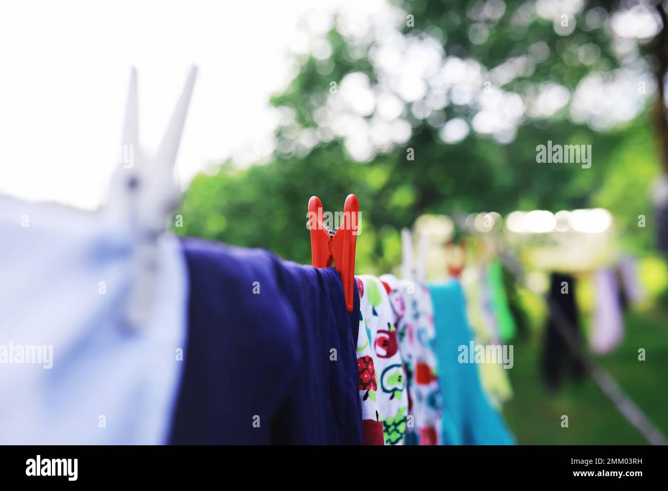 Clothespins on a clothesline in summer. Dry clothes outside. Clothes on ...