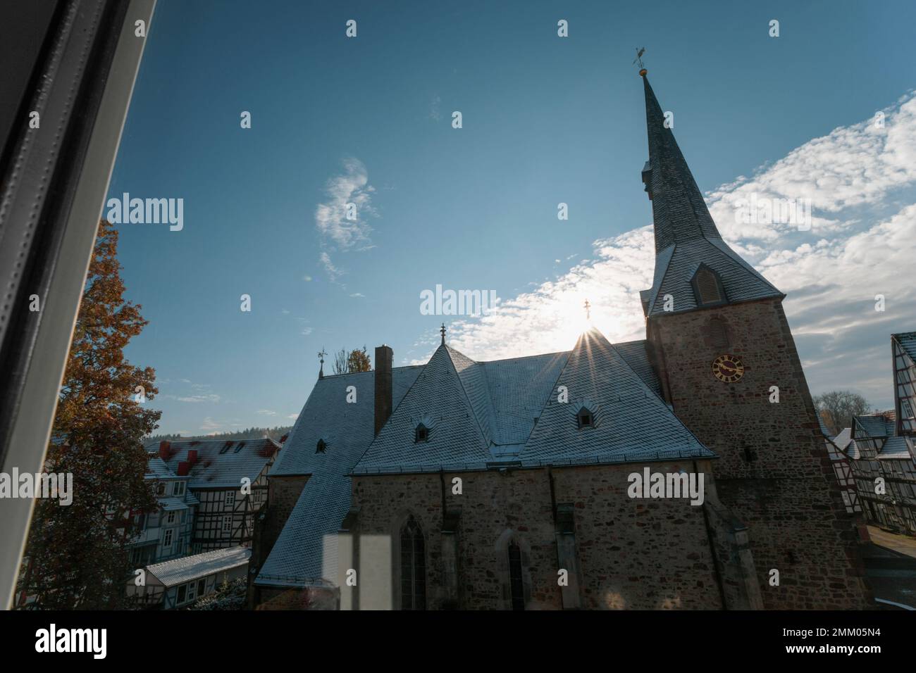 An old German church on a sunny winter day, view from the window of a ...