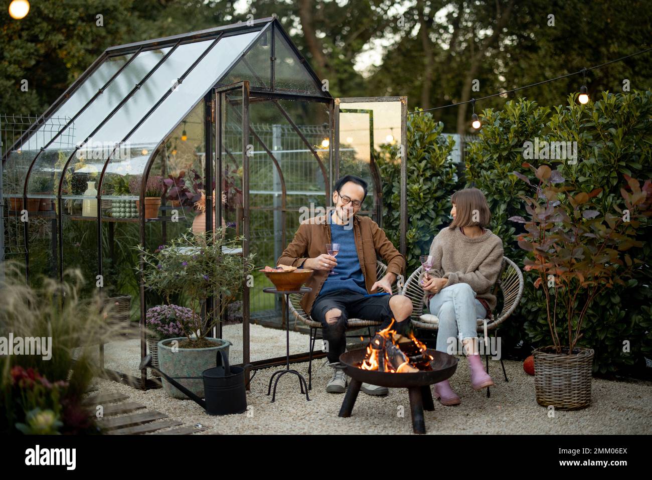 Young couple having fun during romantic and atmospheric dinner by the ...
