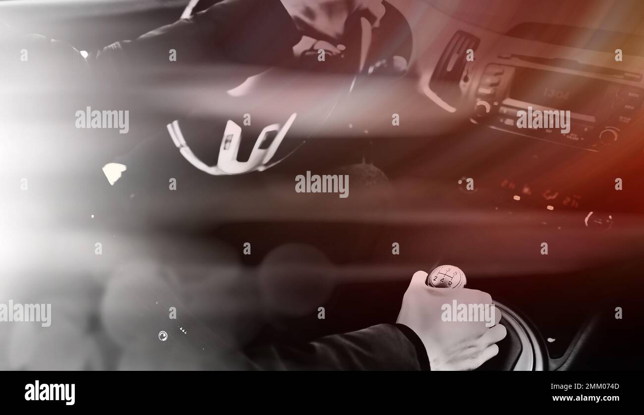 Hand on car gear knob. The driver switches the speed in the car. Hand ...