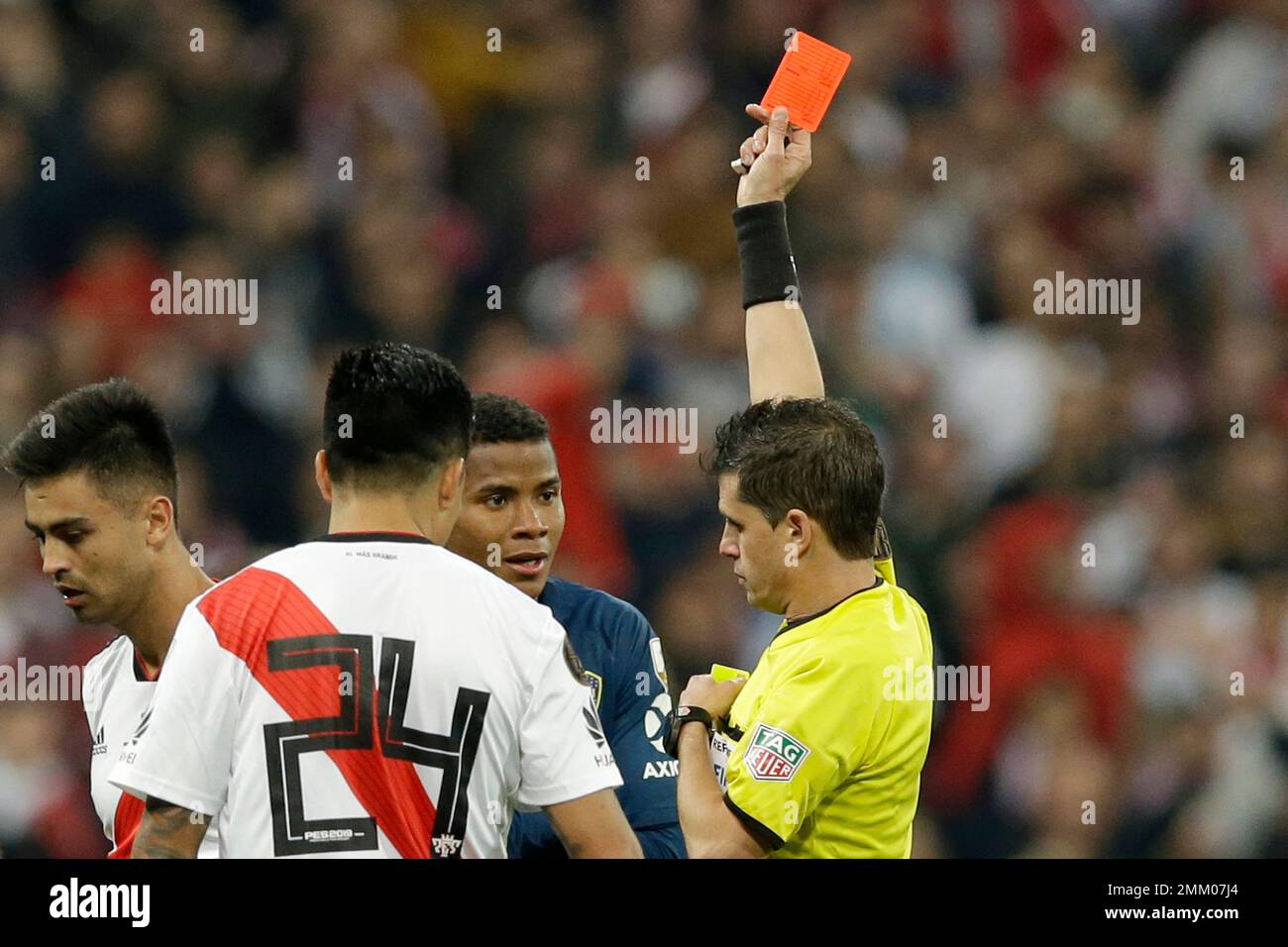 Referee Andres Cunha, of Uruguay, shows a red card to Wilmar Barrios of ...