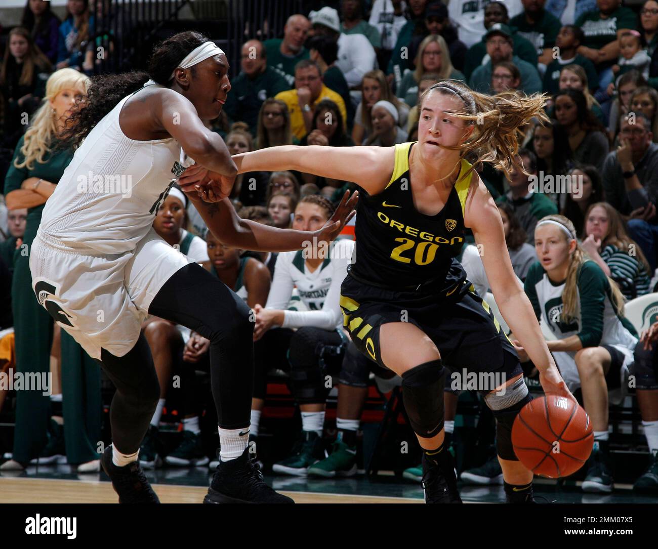 Oregon's Sabrina Ionescu, right, drives against Michigan State's ...
