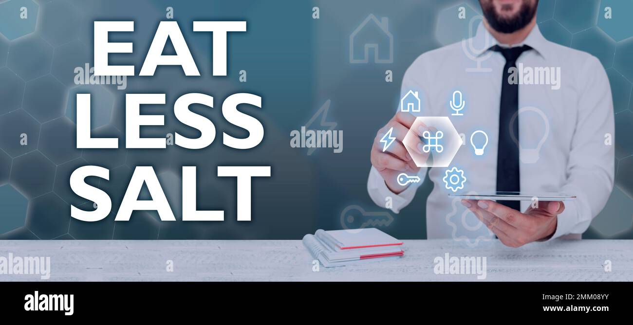 Hand writing sign Eat Less Salt. Word for reducing the sodium intake on ...