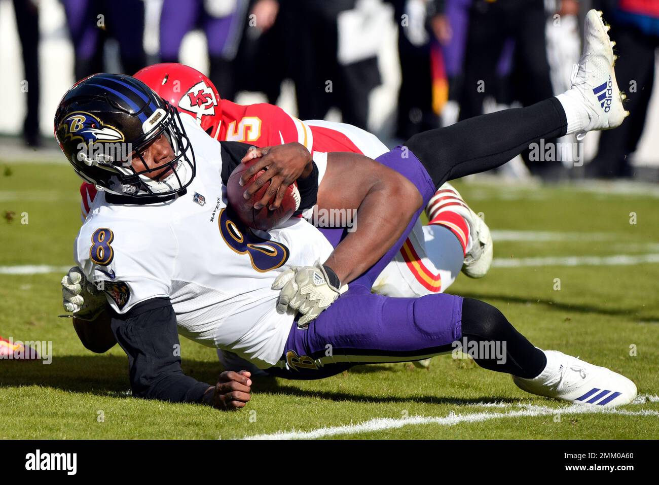 Baltimore Ravens quarterback Lamar Jackson (8) is sacked by Kansas City ...