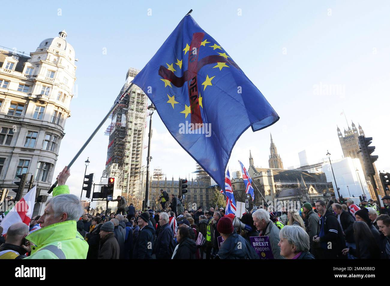 Demonstrators hold placards and flags at the "Brexit Betrayal Rally", a ...