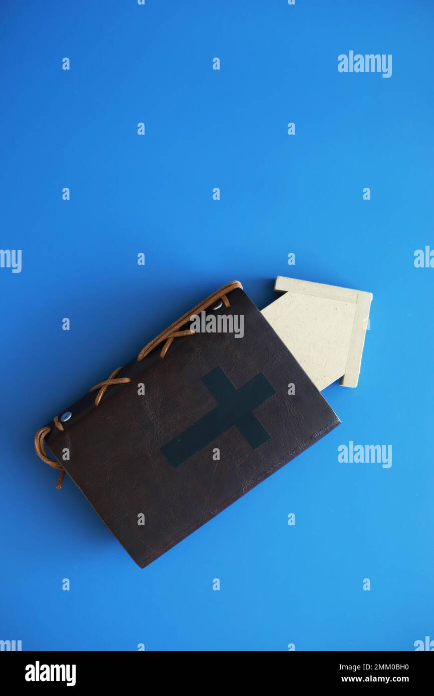 Book with the symbol the cross. Bible study. Religious book. Prayer ...