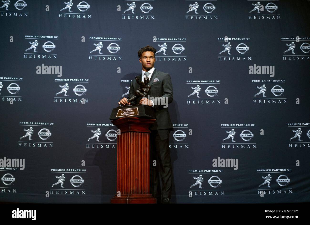 Oklahoma quarterback Kyler Murray poses with the Heisman Trophy after ...