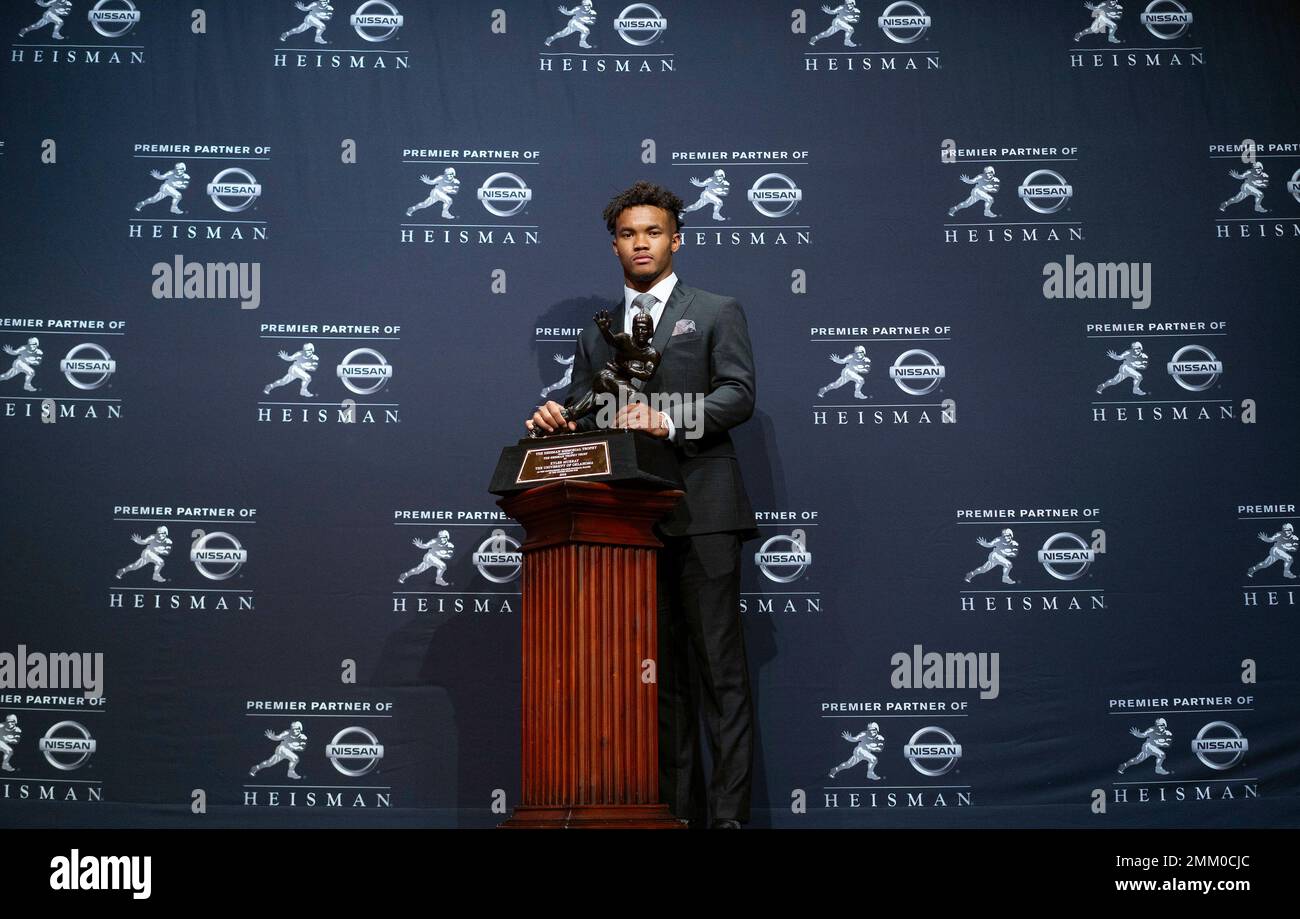 Oklahoma quarterback Kyler Murray poses with the Heisman Trophy after ...