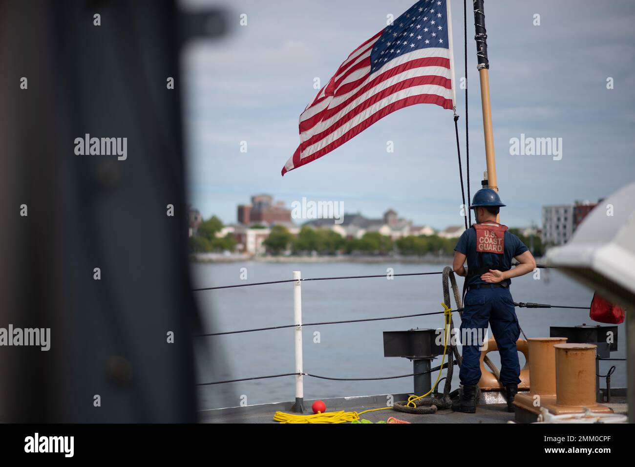 U.S. Coast Guard Seaman Connor Tribby mans his post prior to taking ...