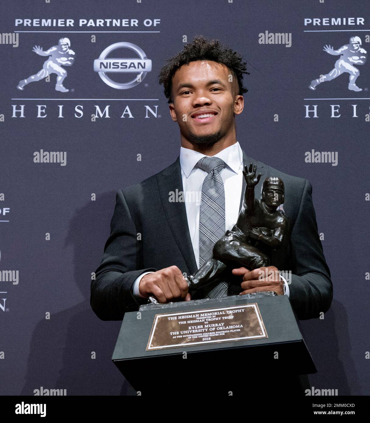 Oklahoma quarterback Kyler Murray poses with the Heisman Trophy after ...