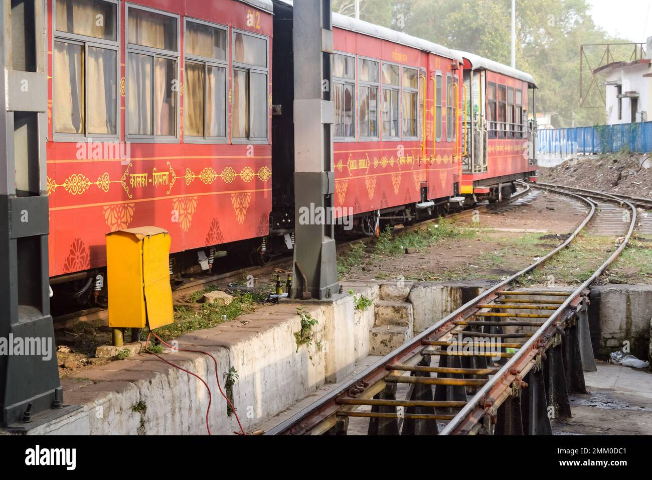 View of Toy train coach from the middle of railway track during daytime ...