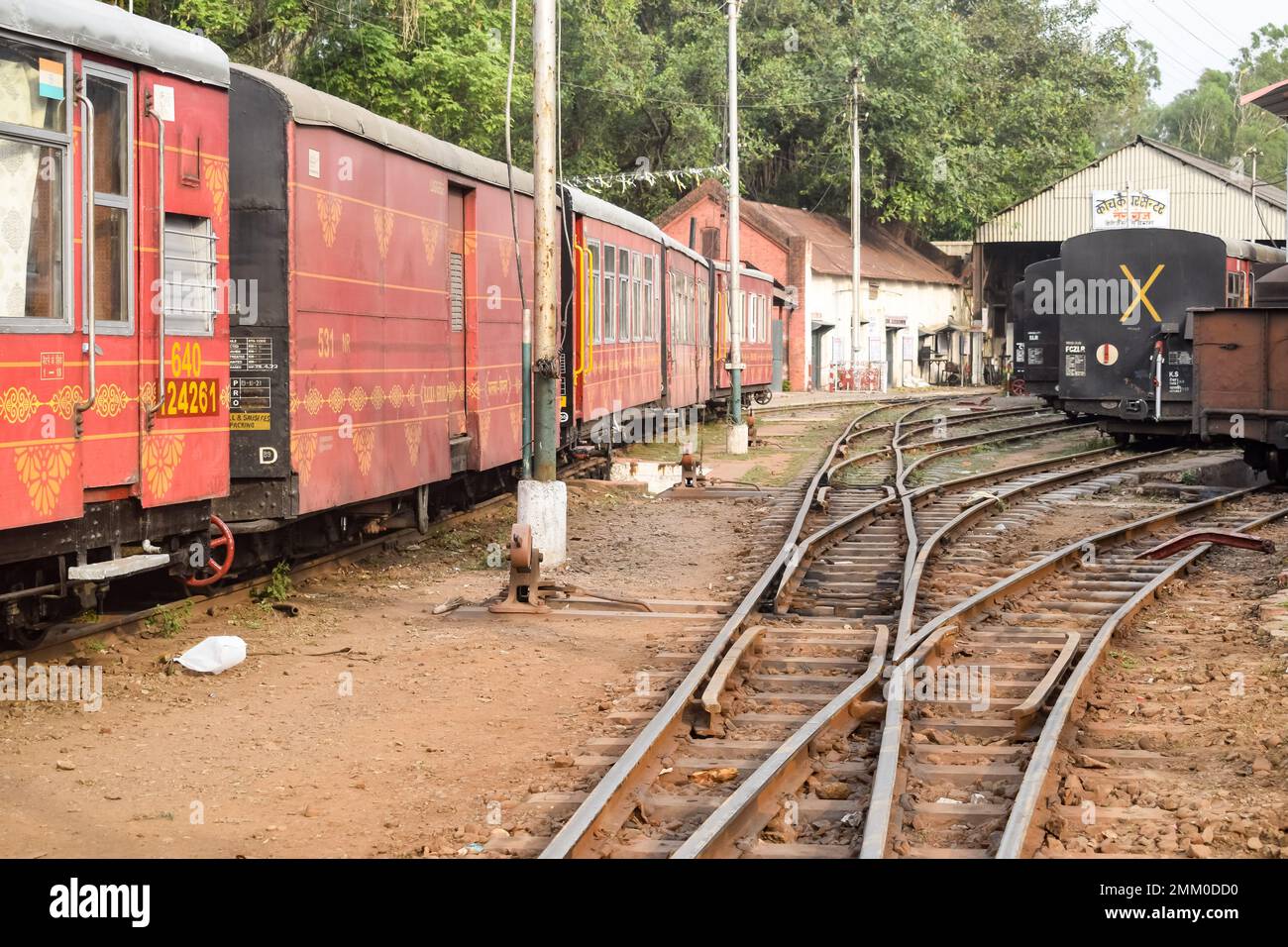 View of Toy train coach from the middle of railway track during daytime ...