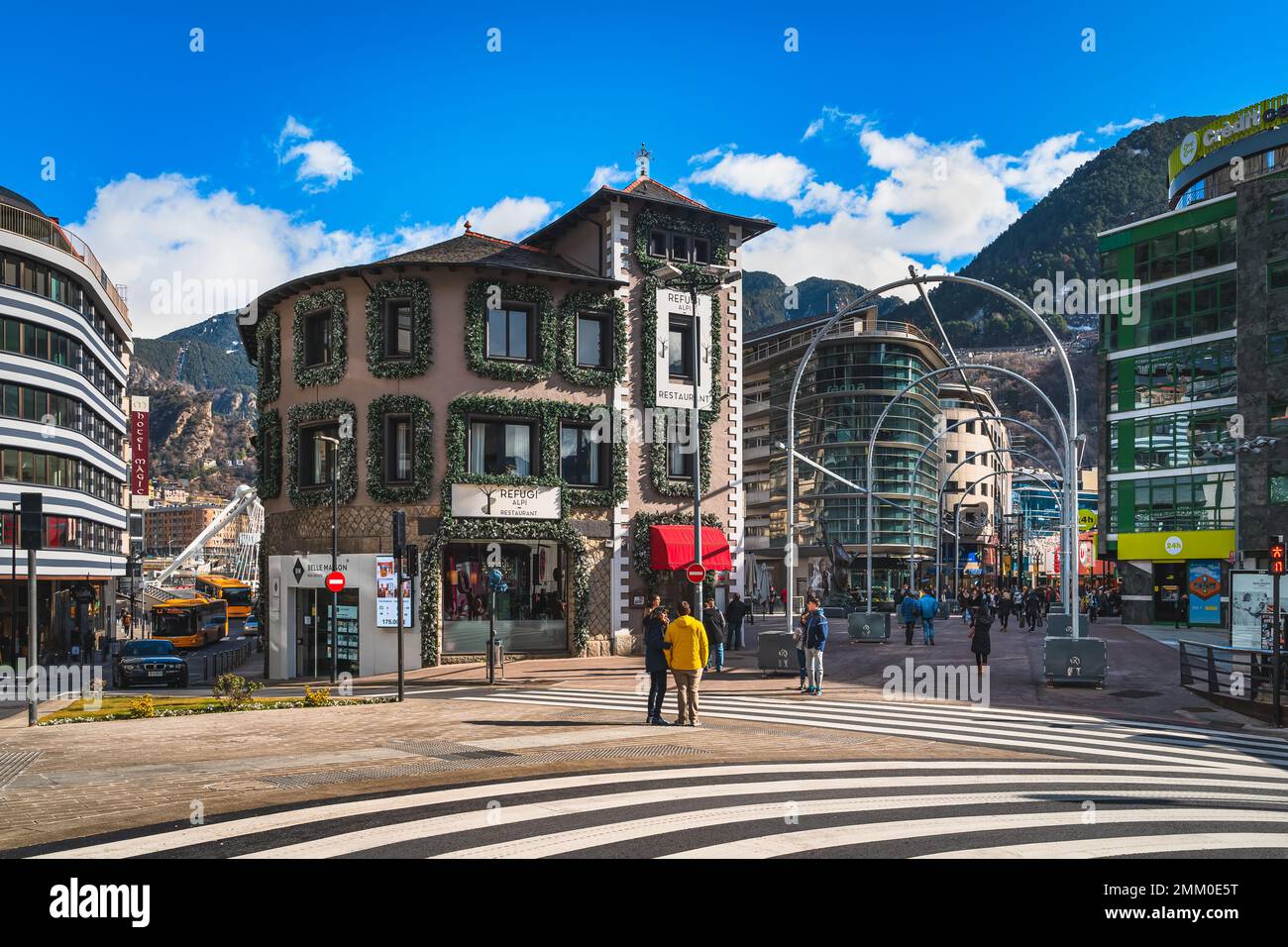 Andorra la Vella, Andorra, Jan 2020 People on duty free shopping, street with modern shops and ...