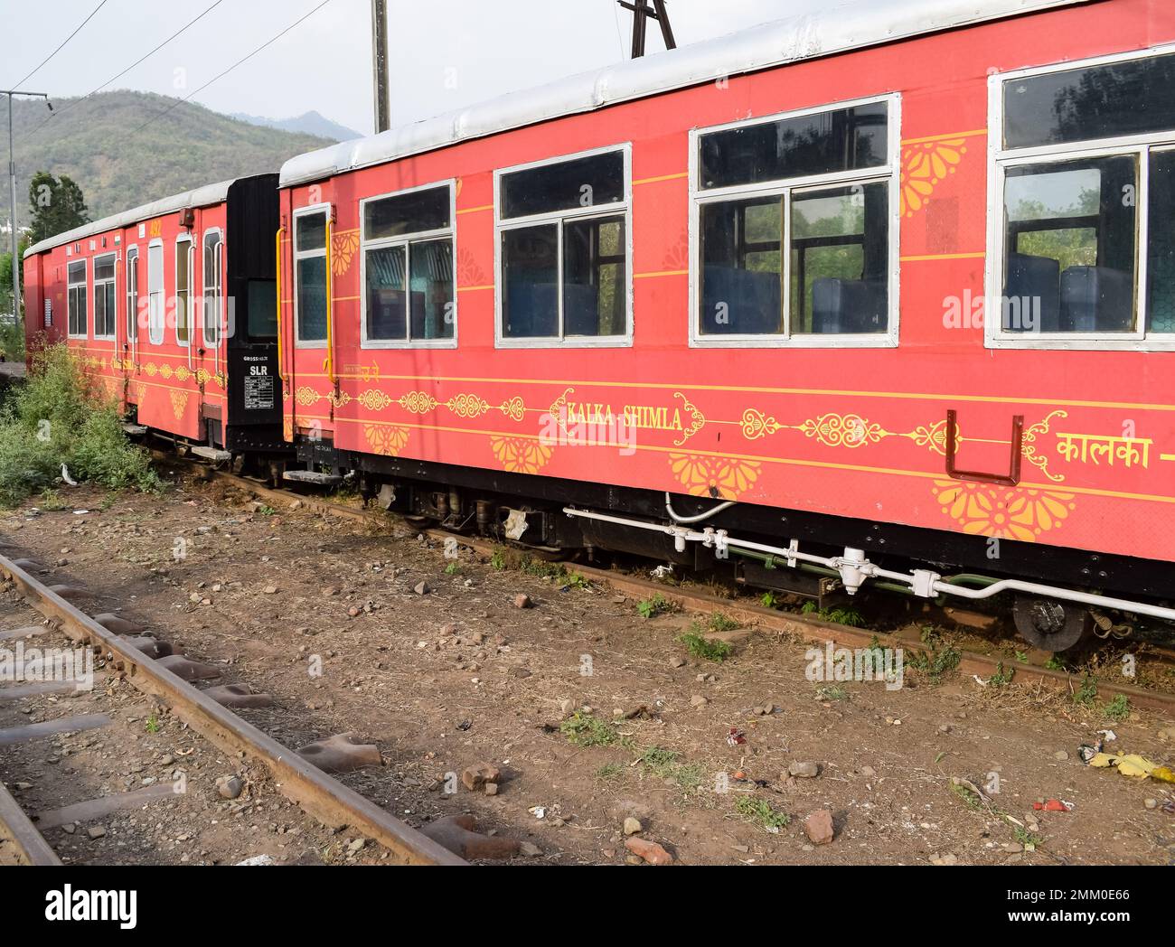 View of Toy train coach from the middle of railway track during daytime ...