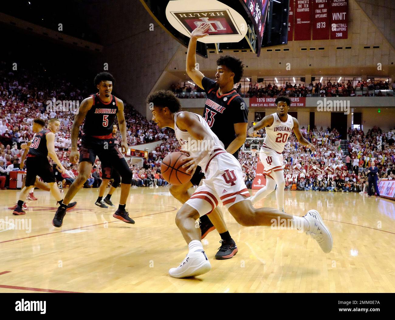 Indiana's Justin Smith (3) goes to the basket against Louisville's ...