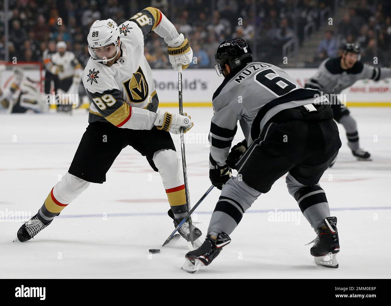 Vegas Golden Knights right wing Alex Tuch, left, battles Los Angeles ...