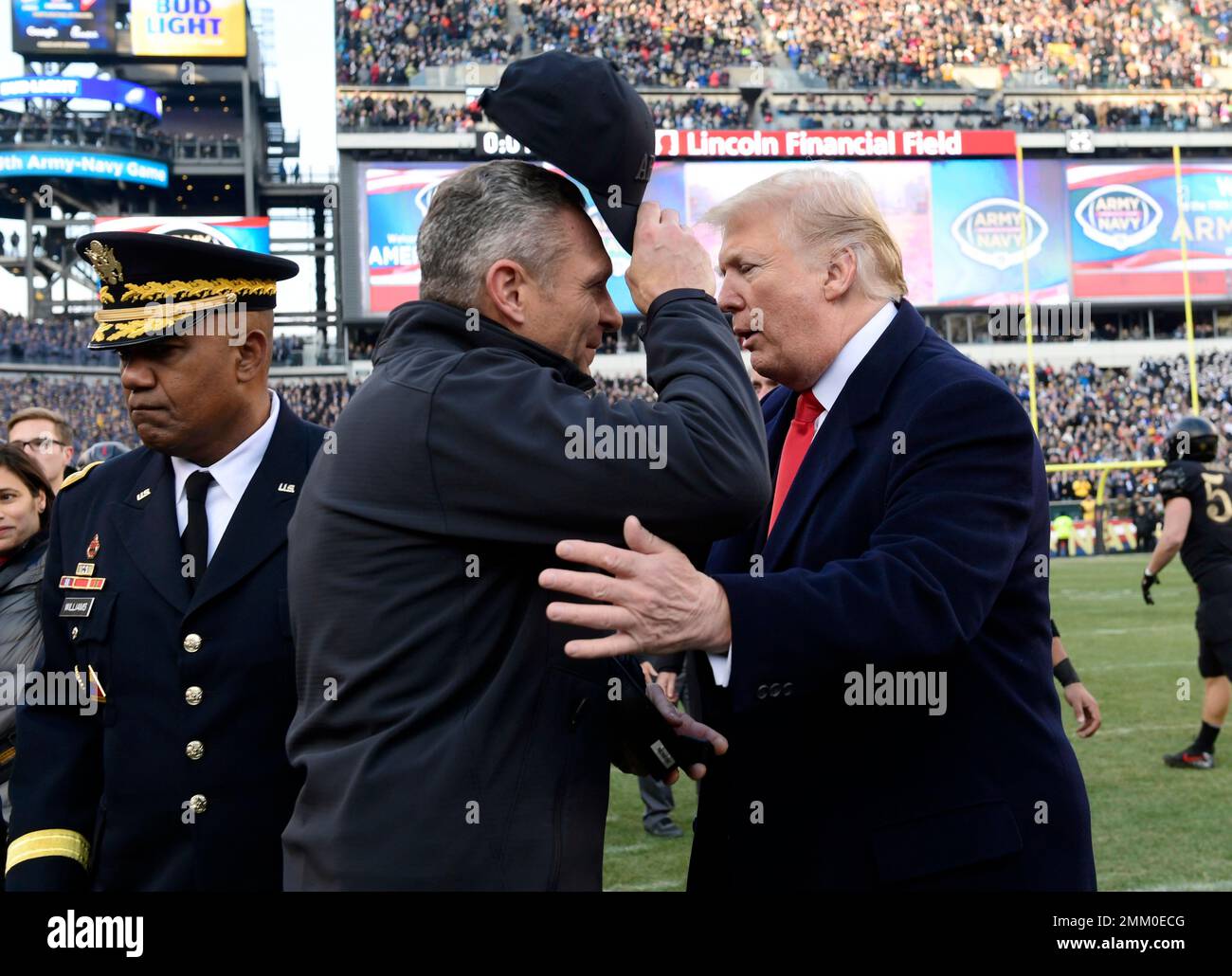 President Donald Trump, right, greets Army coach Jeff Monken before the ...