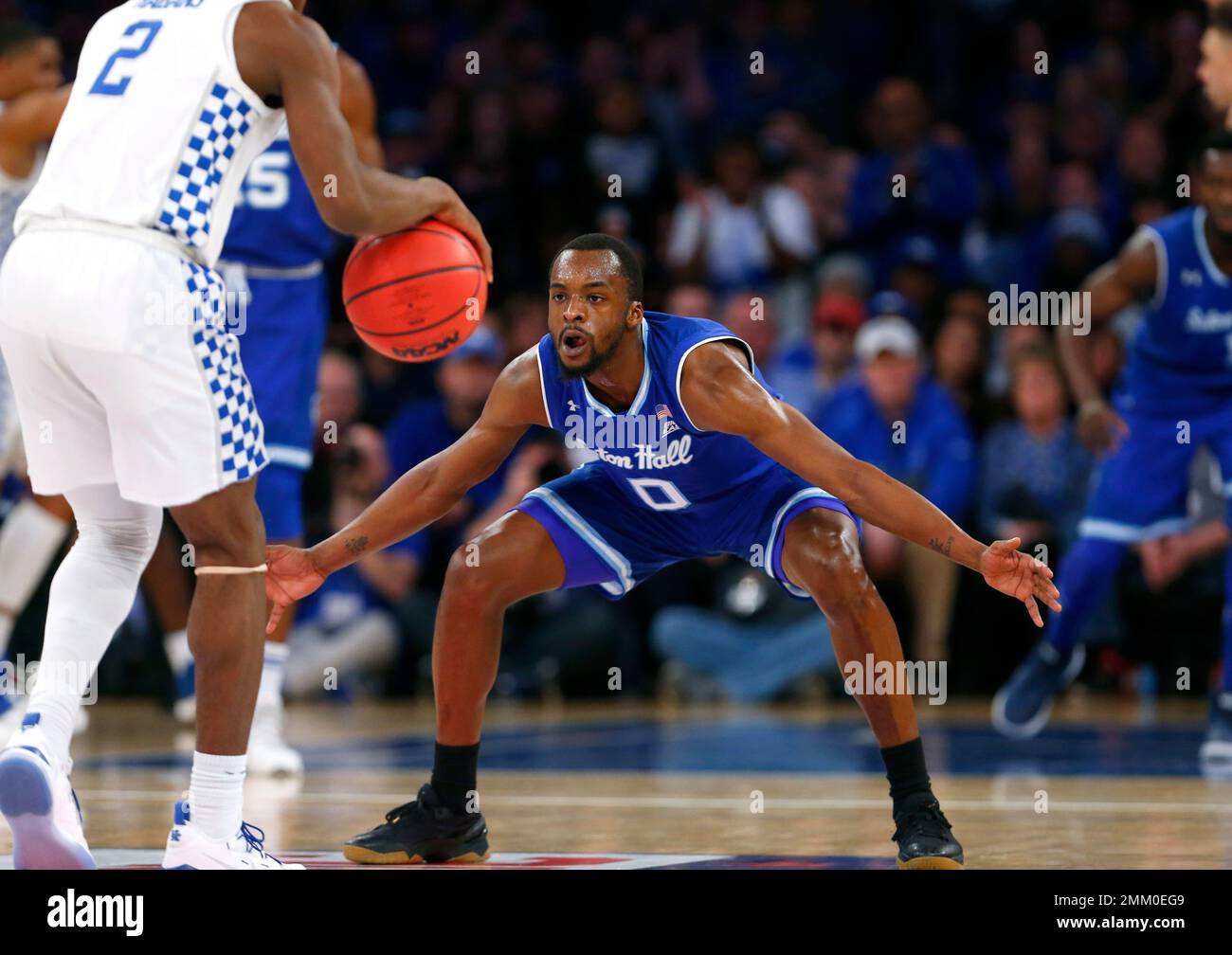 Seton Hall guard Quincy McKnight (0) defends against Kentucky guard ...