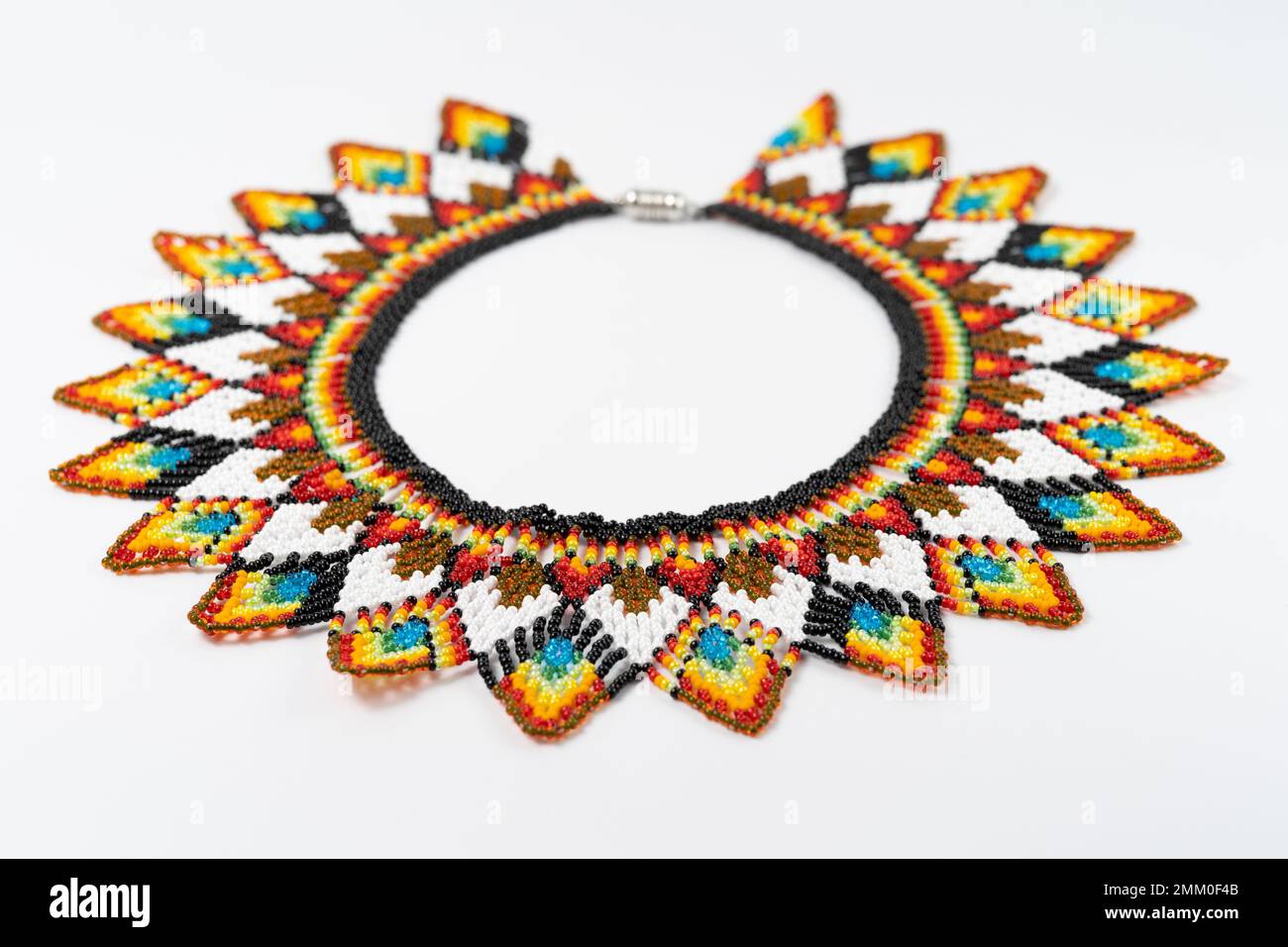 handmade colorful bead necklace close-up isolated on white background ...