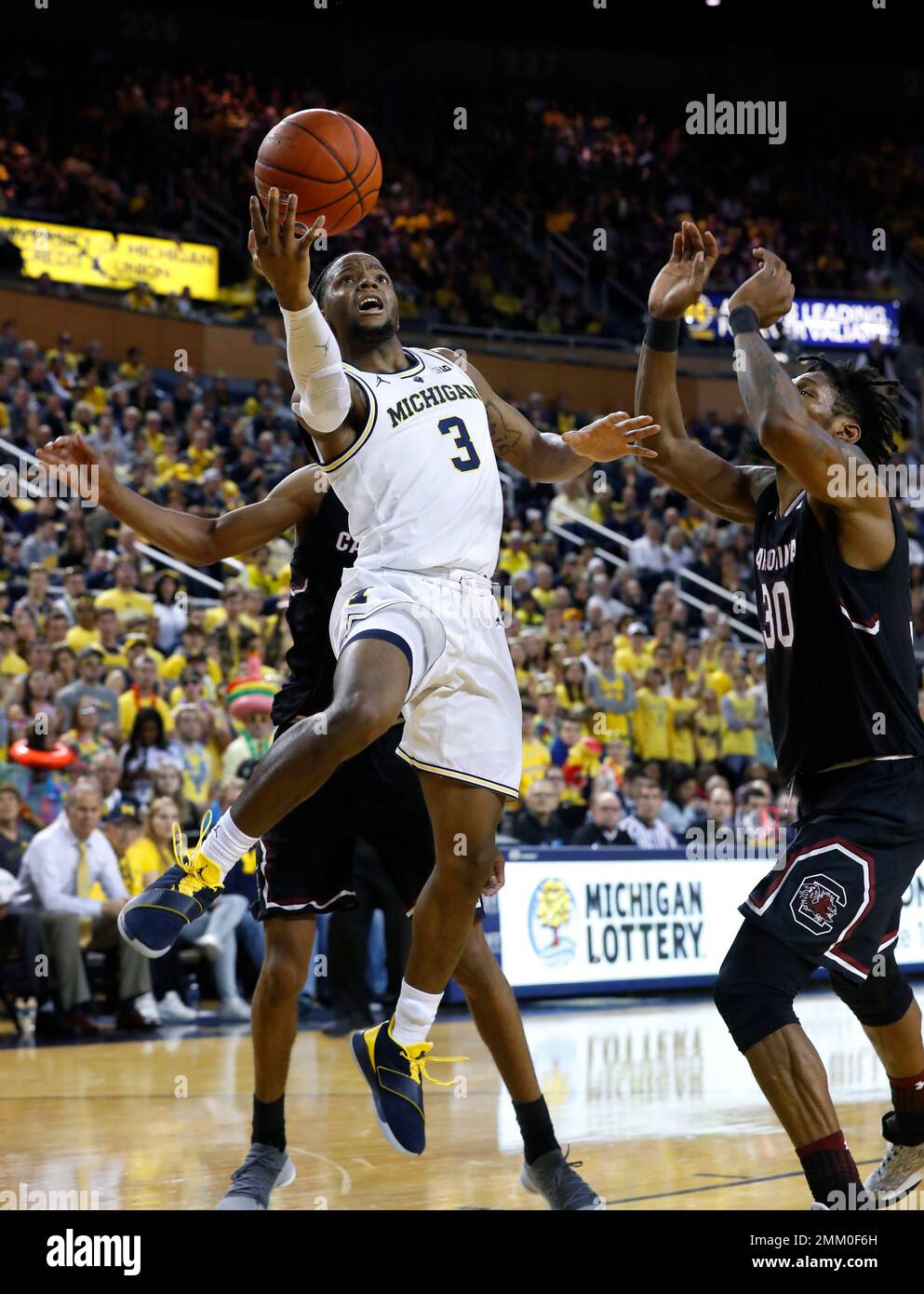 Michigan guard Zavier Simpson (3) drives against South Carolina in the ...