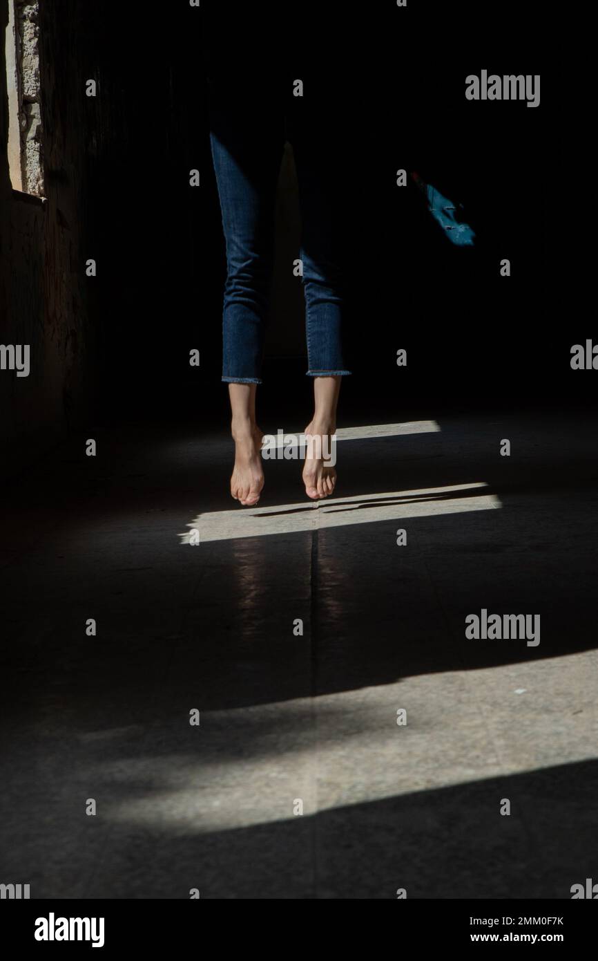 Fear concept an identified person trapped in a dark abandoned room ...