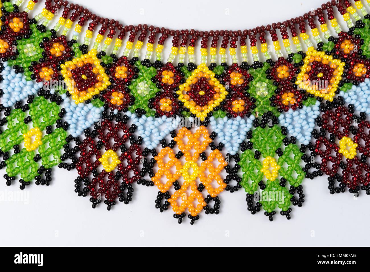 handmade colorful bead necklace close-up isolated on white background ...