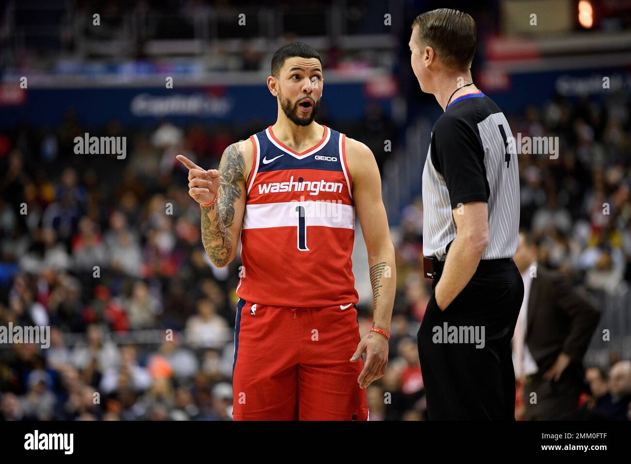 Washington Wizards guard Austin Rivers (1) talks with referee Ed Malloy ...