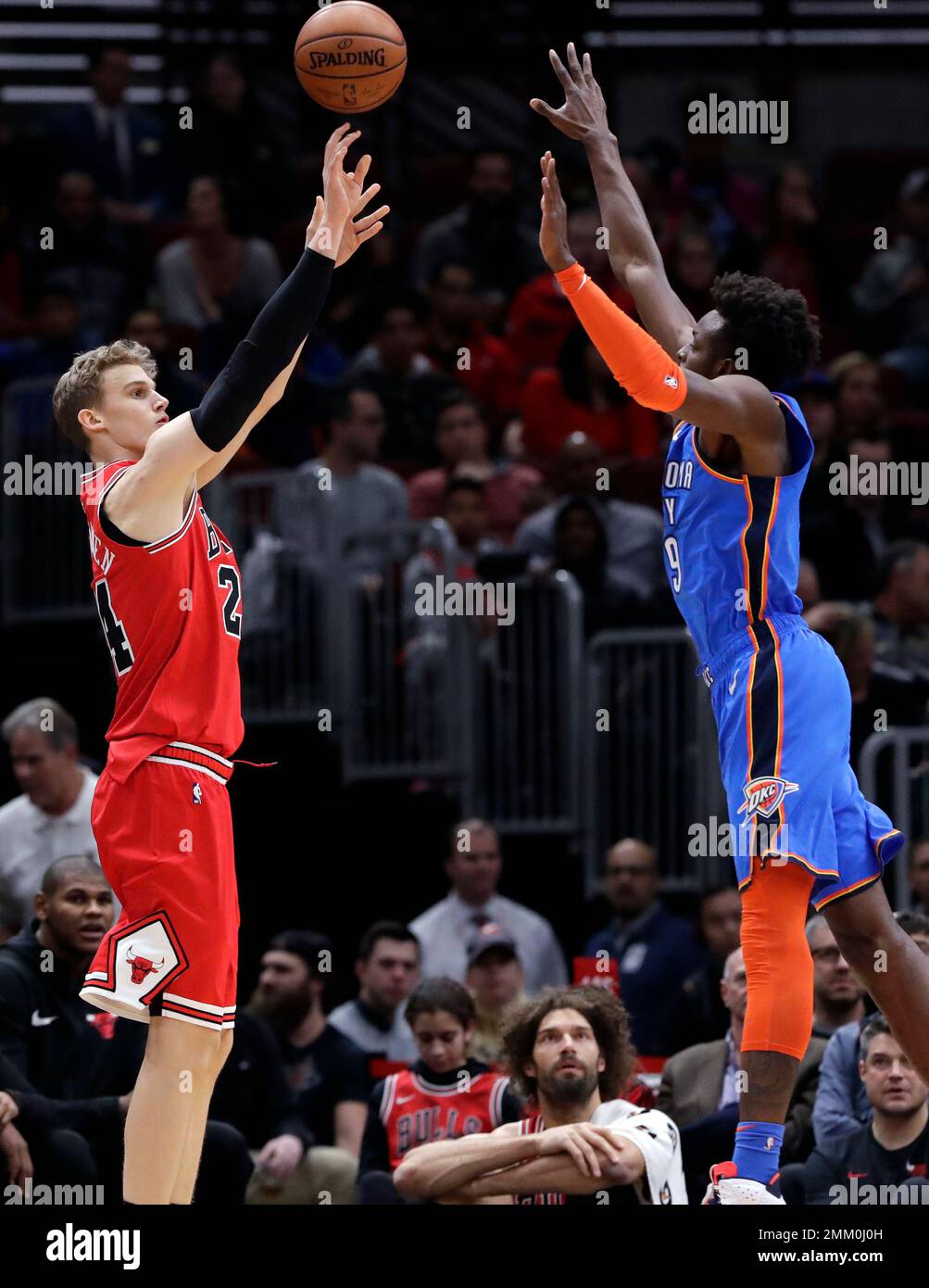 Chicago Bulls forward Lauri Markkanen, left, shoots over Oklahoma City ...