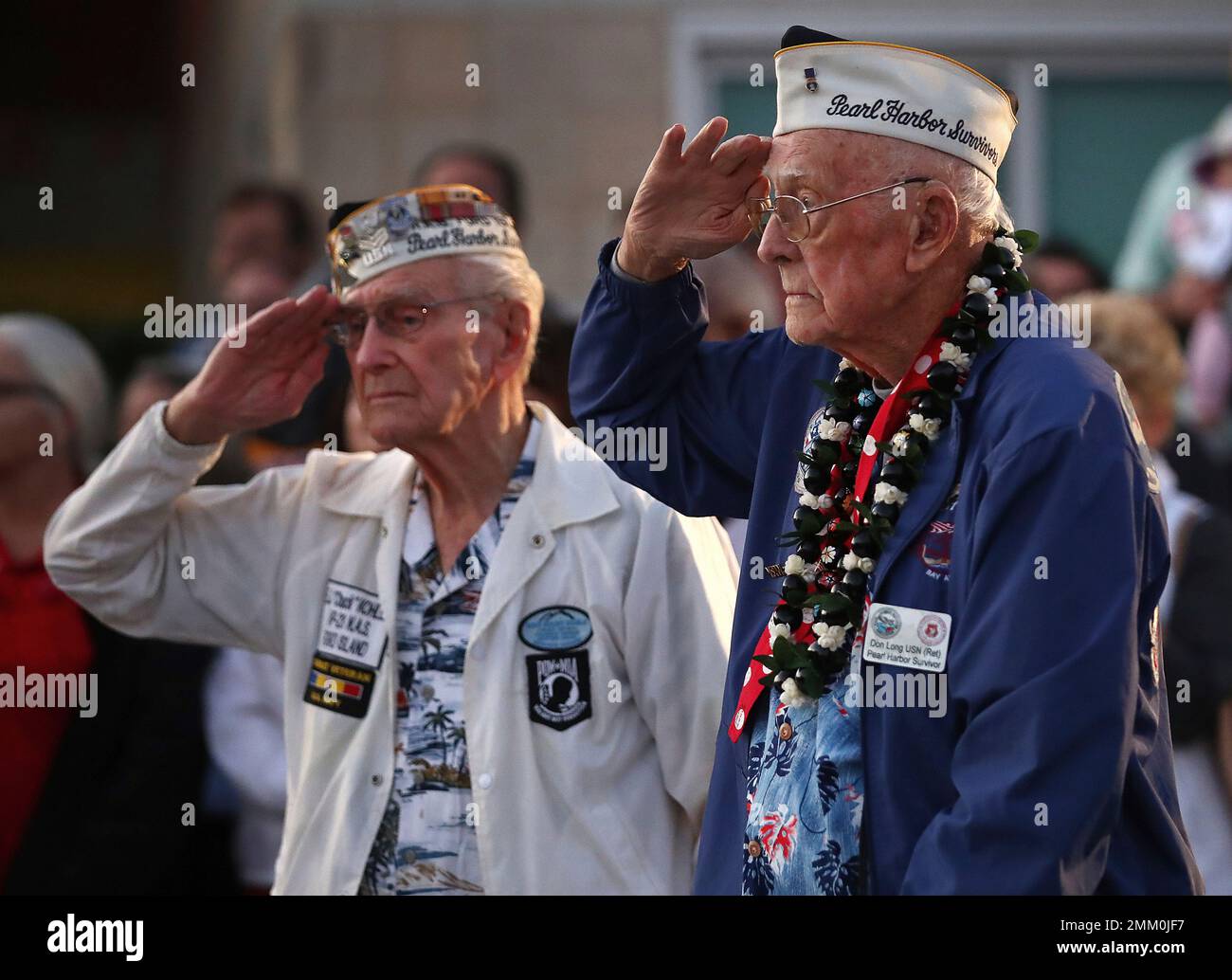 Pearl Harbor survivors Earl "Chuck" Kohler, left, and Don Long salute ...
