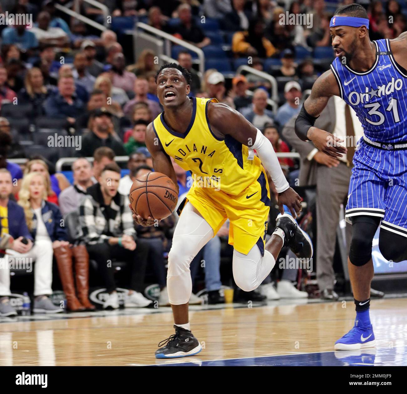Indiana Pacers' Darren Collison, left, goes to the basket past Orlando ...