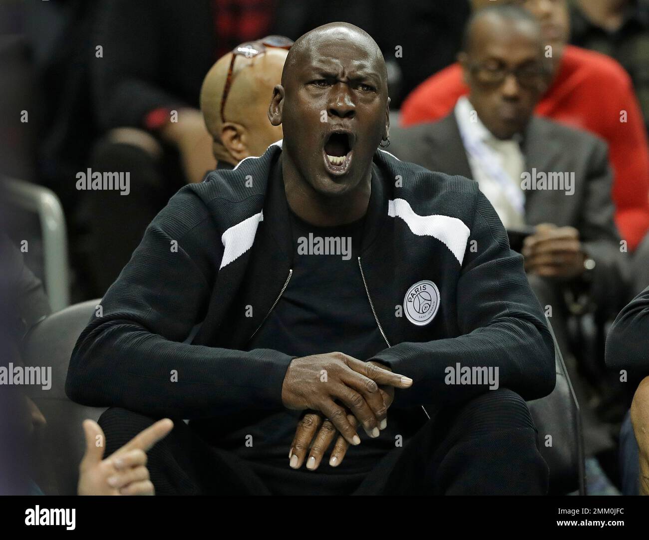 Charlotte Hornets owner Michael Jordan shouts at an official during the ...