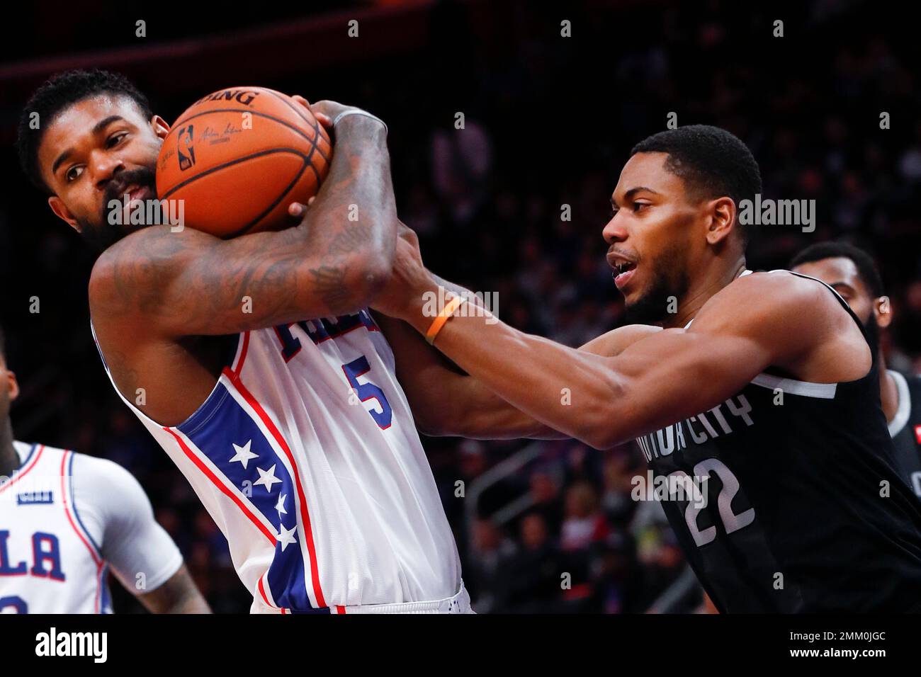 Philadelphia 76ers center Amir Johnson (5) and Detroit Pistons guard ...
