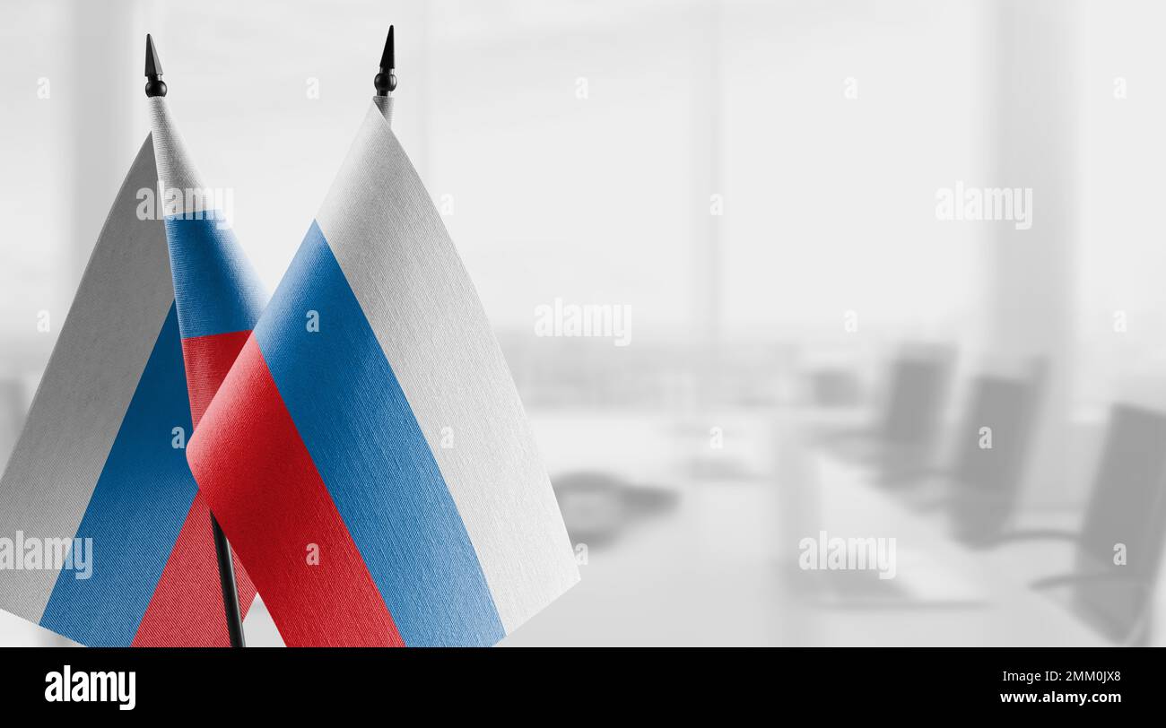 Small flags of the Russia on an abstract blurry background Stock Photo ...