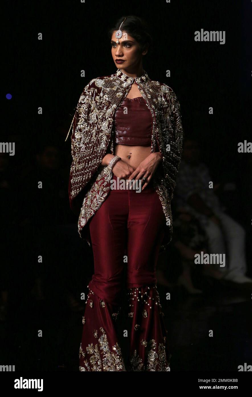 A model presents a creation by designer Reema Hasan during Bridal ...
