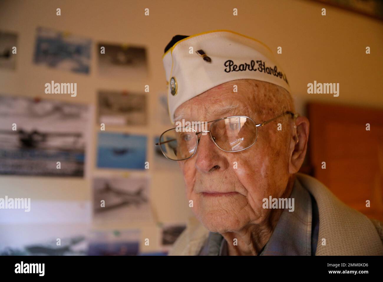 Pearl Harbor attack survivor Don Long looks out the window from his ...