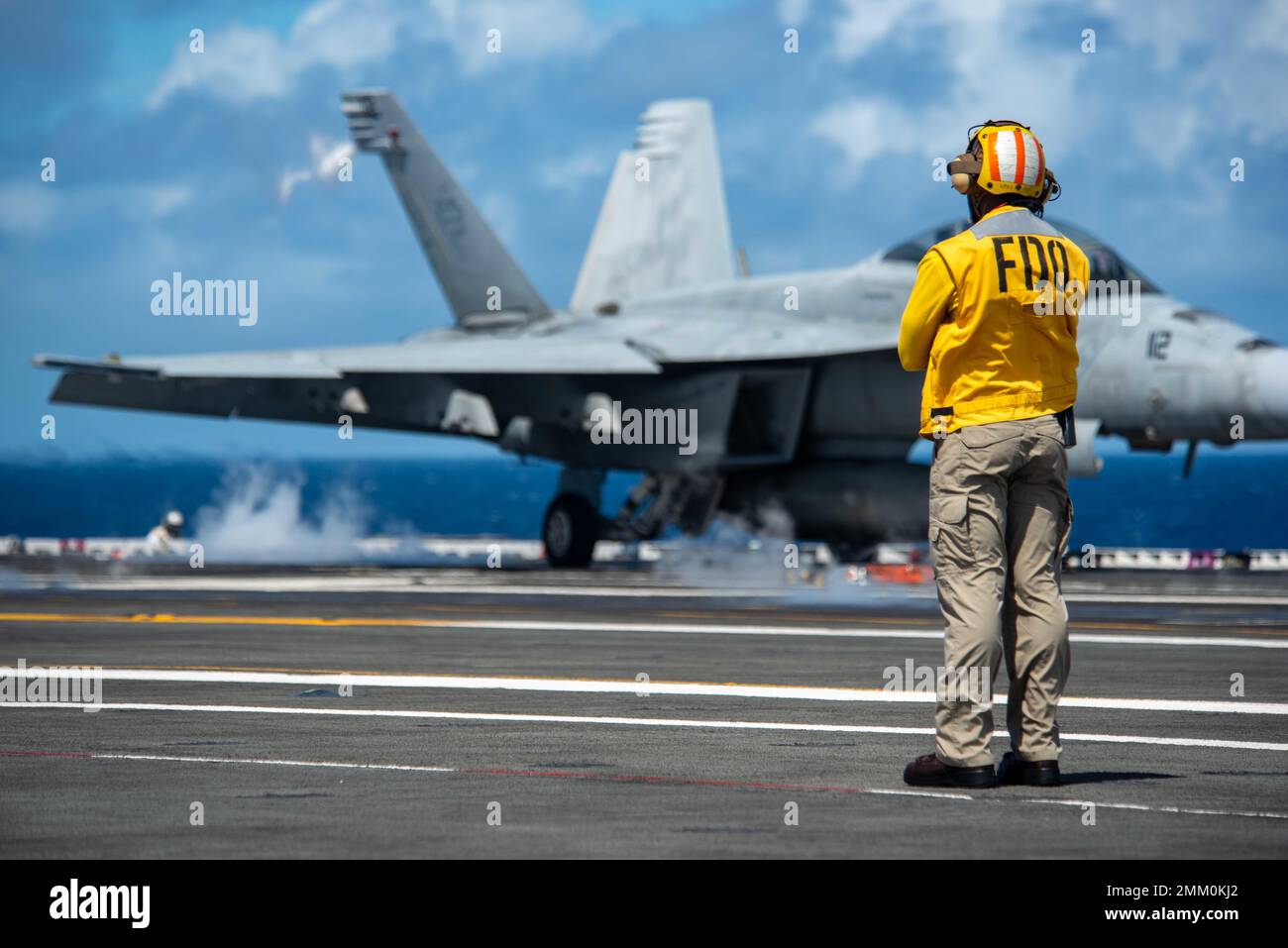 220913-N-DW158-1042 PACIFIC OCEAN (Sept. 13, 2022) Lt. Kerwin Auguste, flight deck officer ...