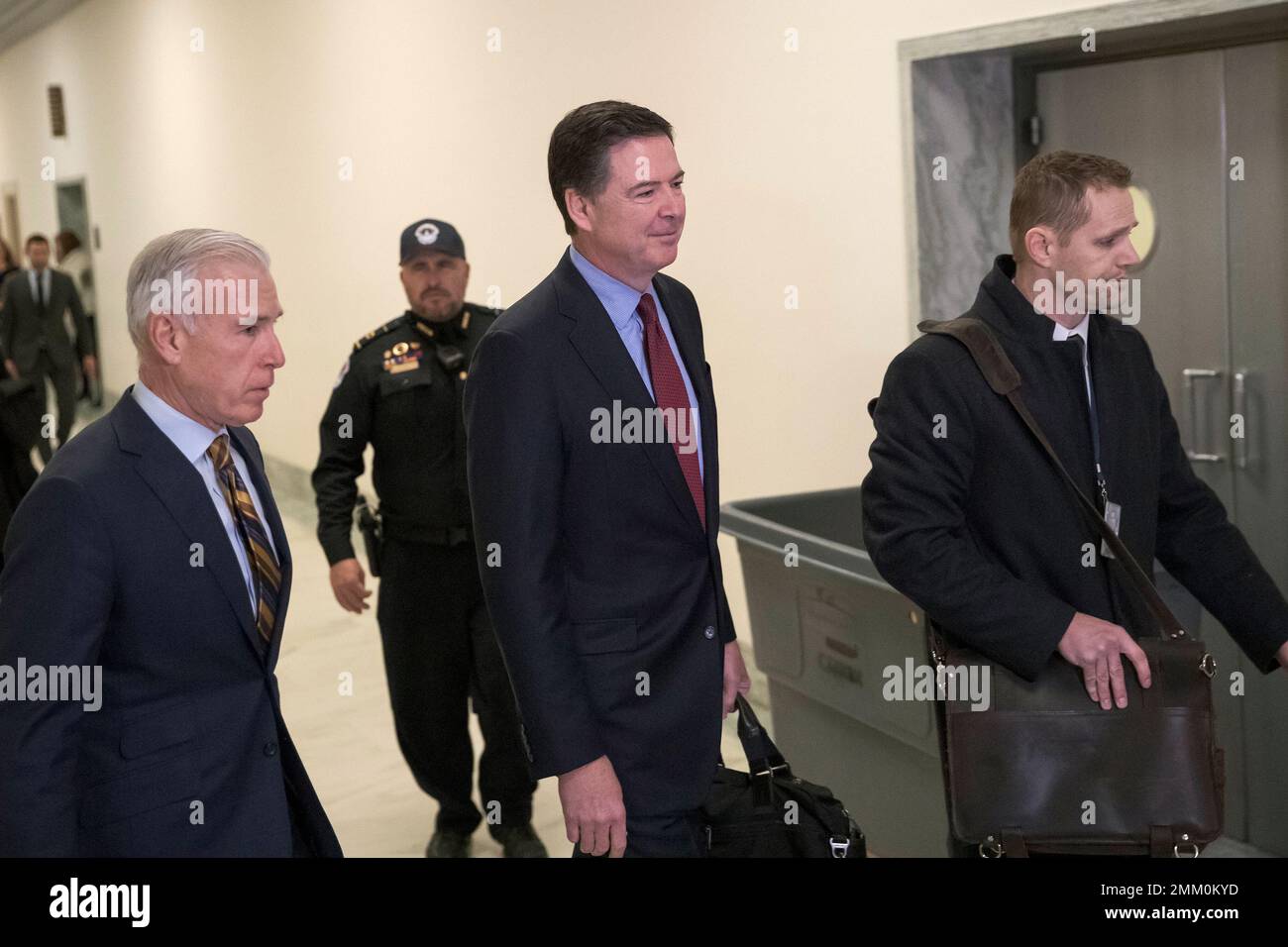 Former FBI Director James Comey, with his attorney, David Kelley, left ...
