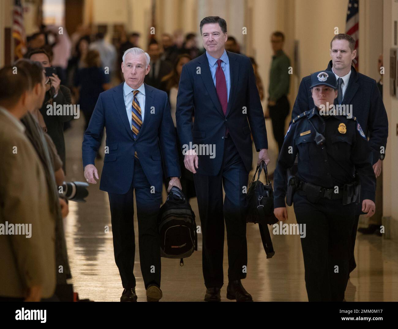 Former FBI Director James Comey, with his attorney, David Kelley, left ...