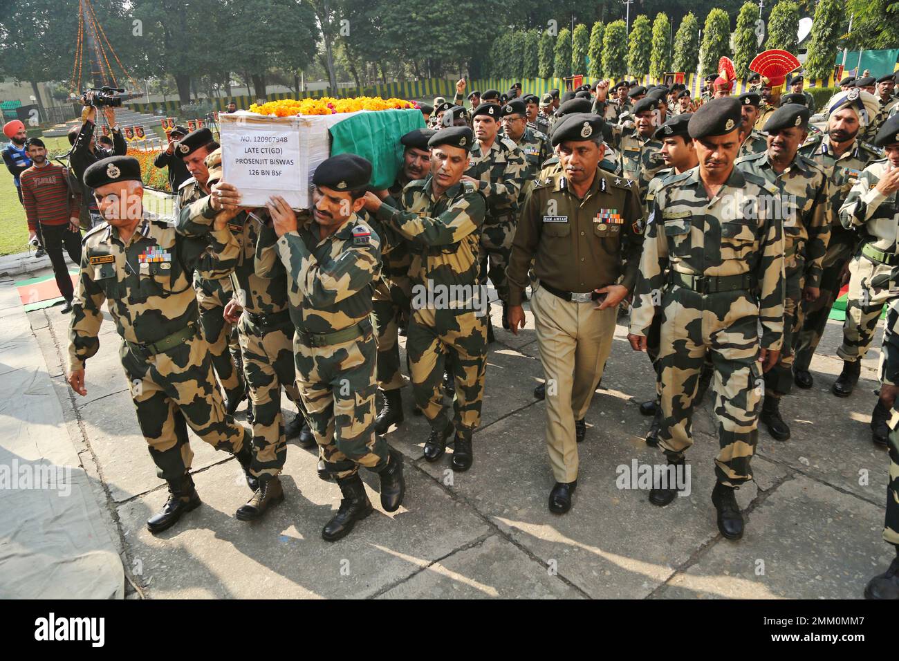 Indian Border Security Force (BSF) soldiers carry the coffin of their ...