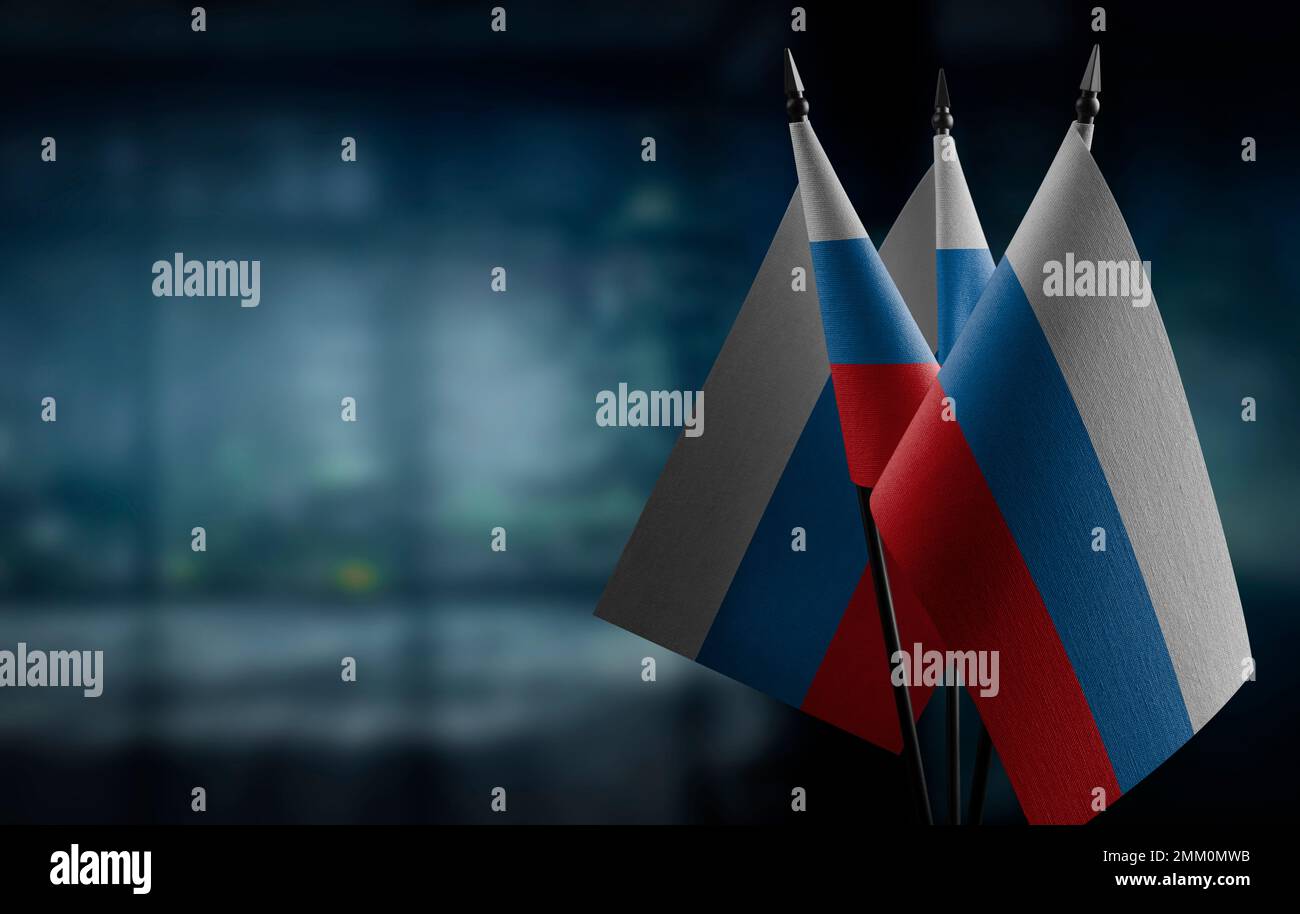 Small flags of the Russia on an abstract blurry background Stock Photo ...
