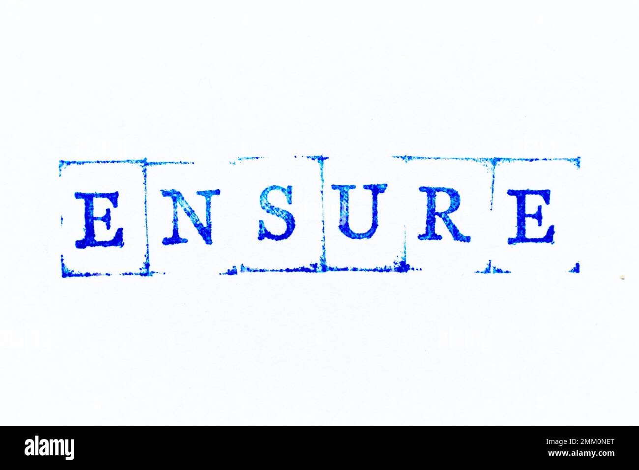 Blue color ink rubber stamp in word ensure on white paper background ...