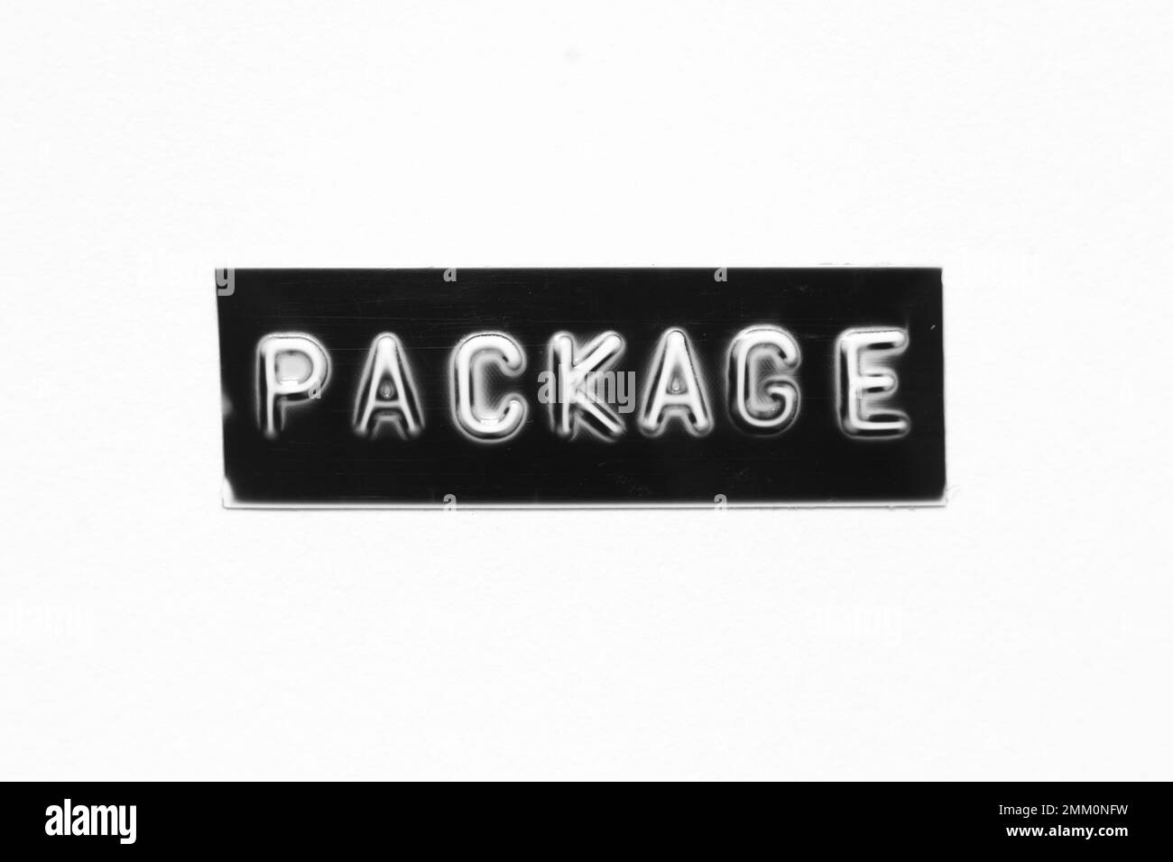 Black color banner that have embossed letter with word package on white ...