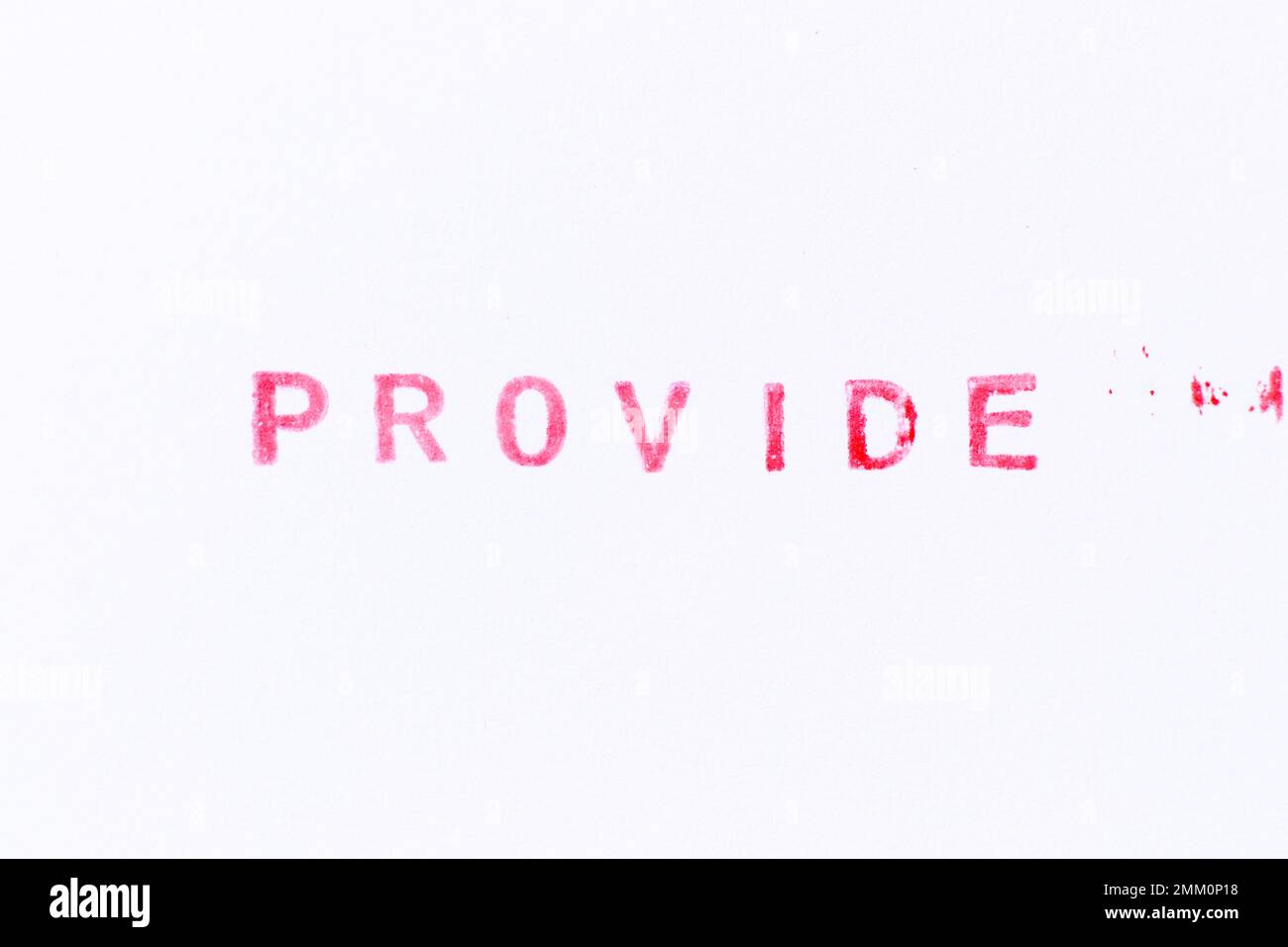 Red color ink rubber stamp in word provide on white paper background ...
